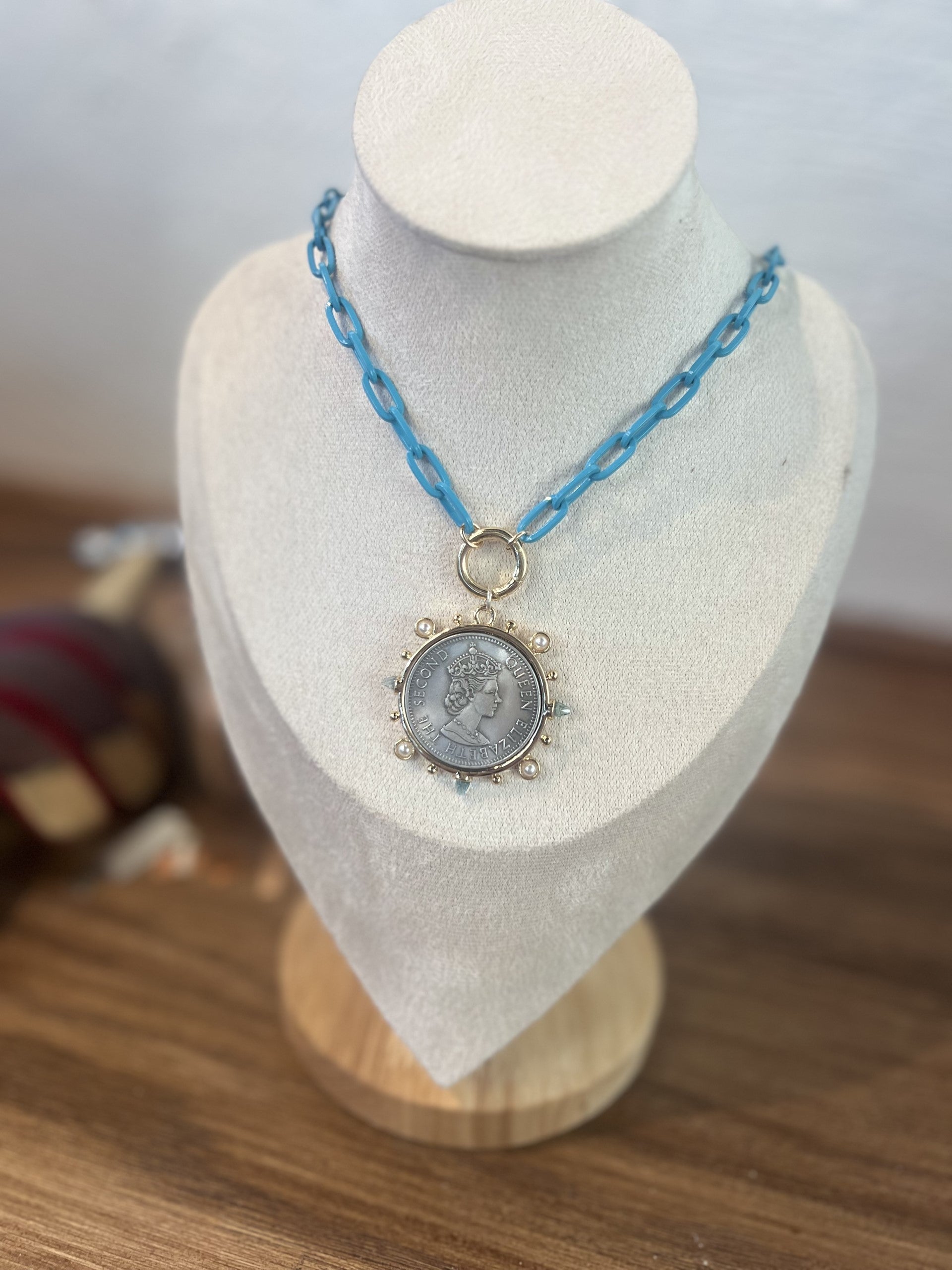 Queen with blue paperclip – GRACE by Kathleen Weatherford